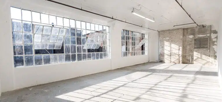 Photo studio with exposed brick and concrete wall available for rent in NY