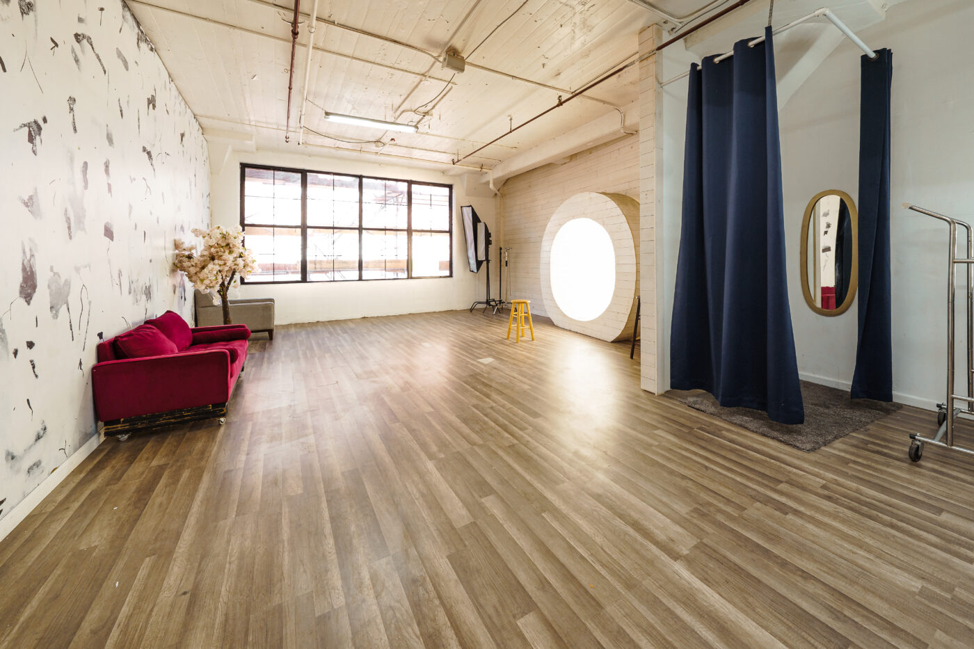 Photo studio with included equipment and artistic painted wall