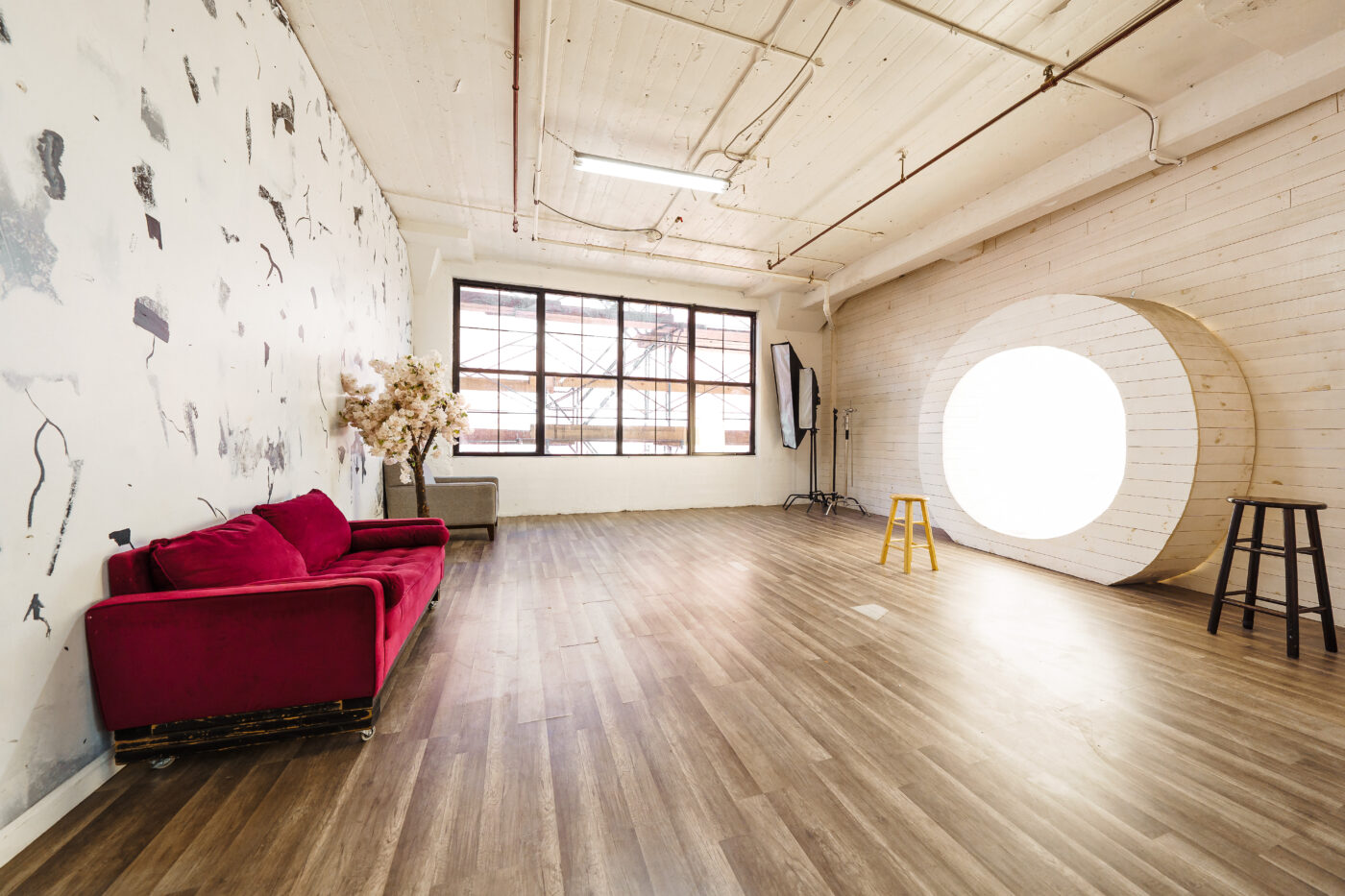 Photo studio with included equipment and artistic painted wall