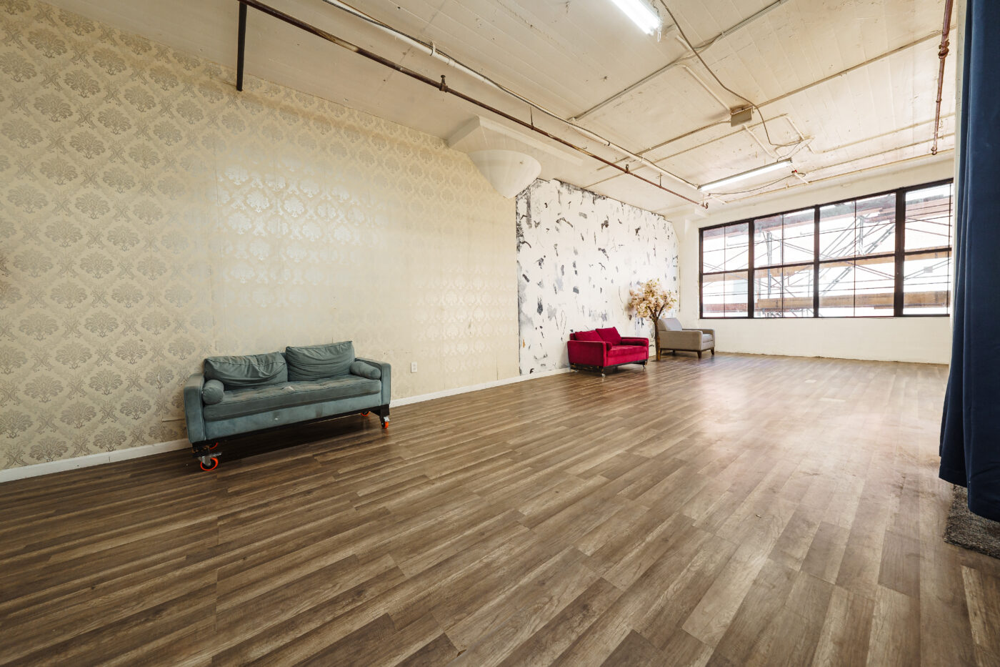 Photo studio with included equipment and artistic painted wall