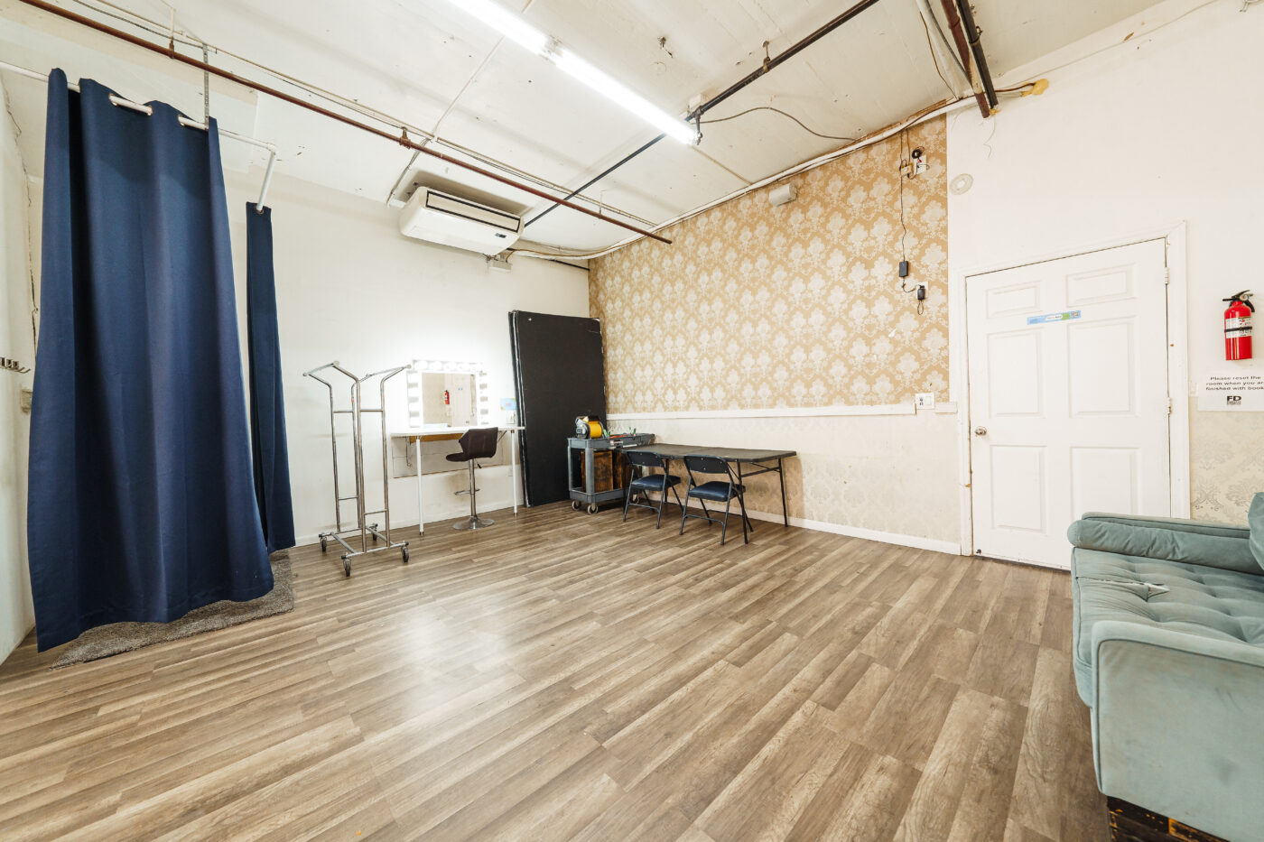 Photo studio with included equipment and artistic painted wall