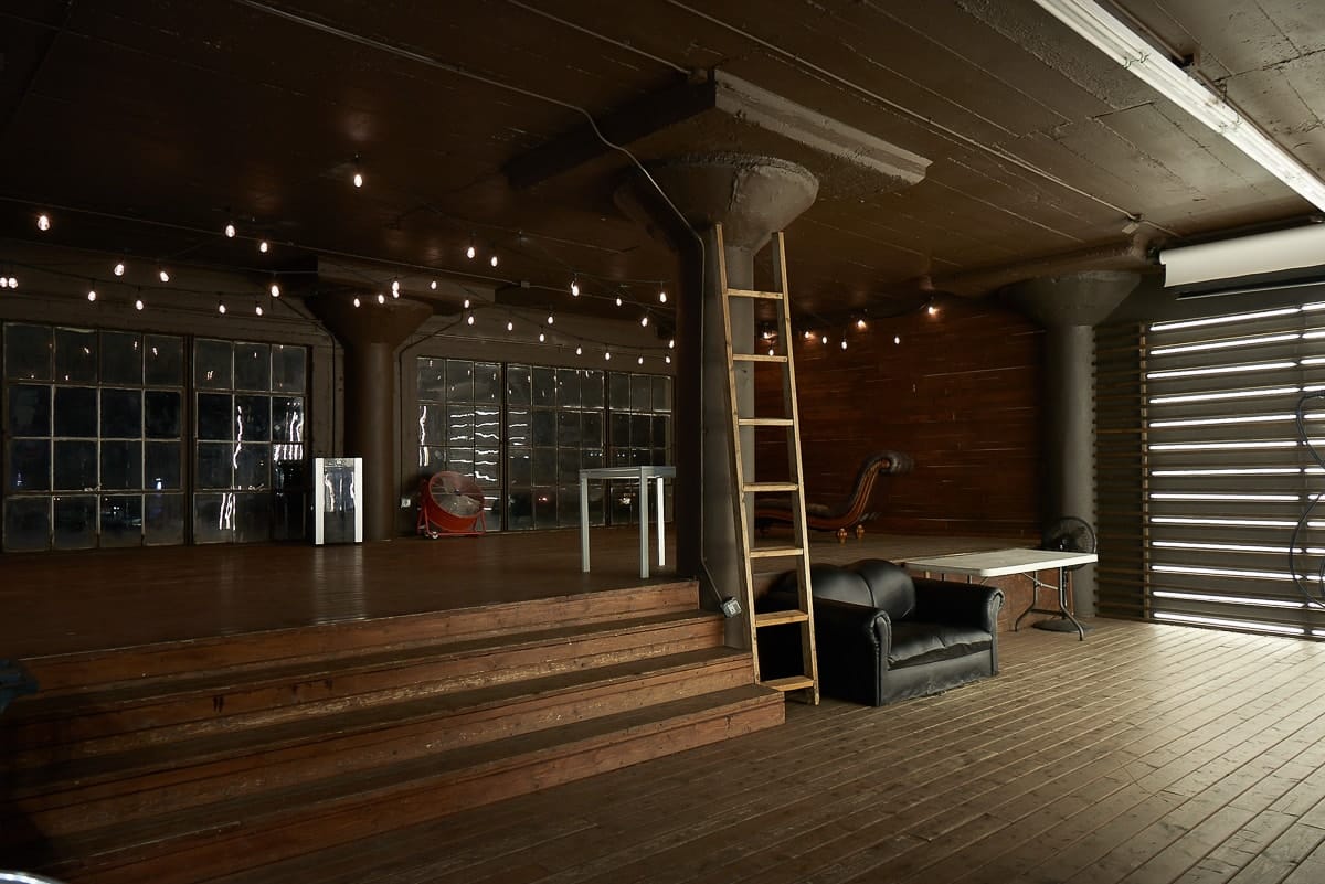 Wood platform stage with LED lights corner, brick and reclaimed wood ...