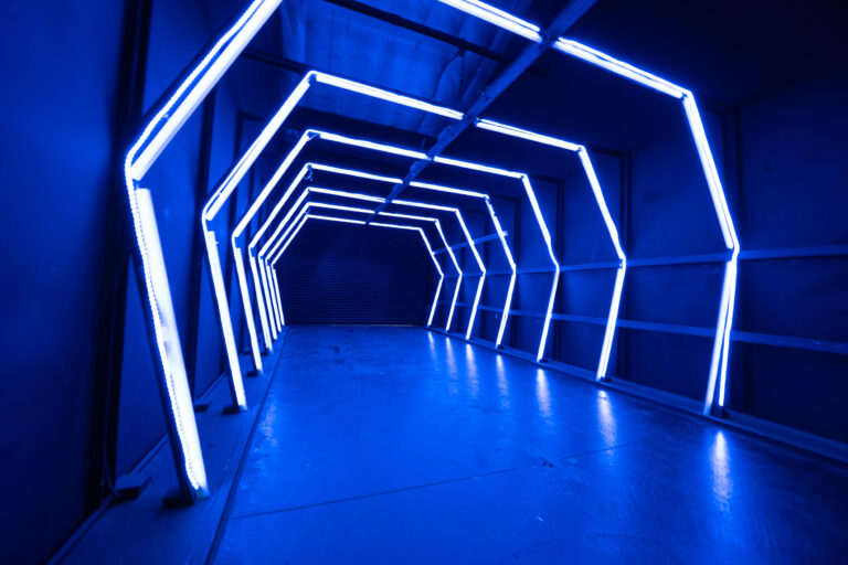 Car photo studio with large black cyc wall, rain feature and LED tunnel