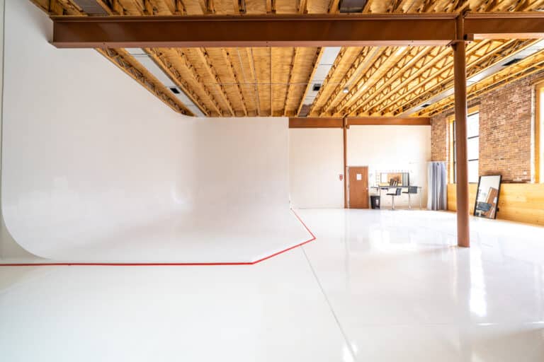 Photo studio with hardwood floors, vibrant colorful walls and big North ...